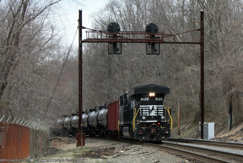 NS 8129 and empty oil train 65R